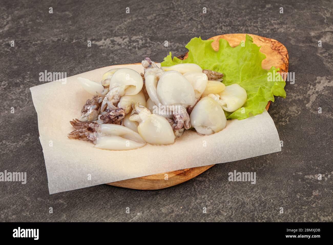 Raw seafood - cuttlefish for cooking over board Stock Photo - Alamy