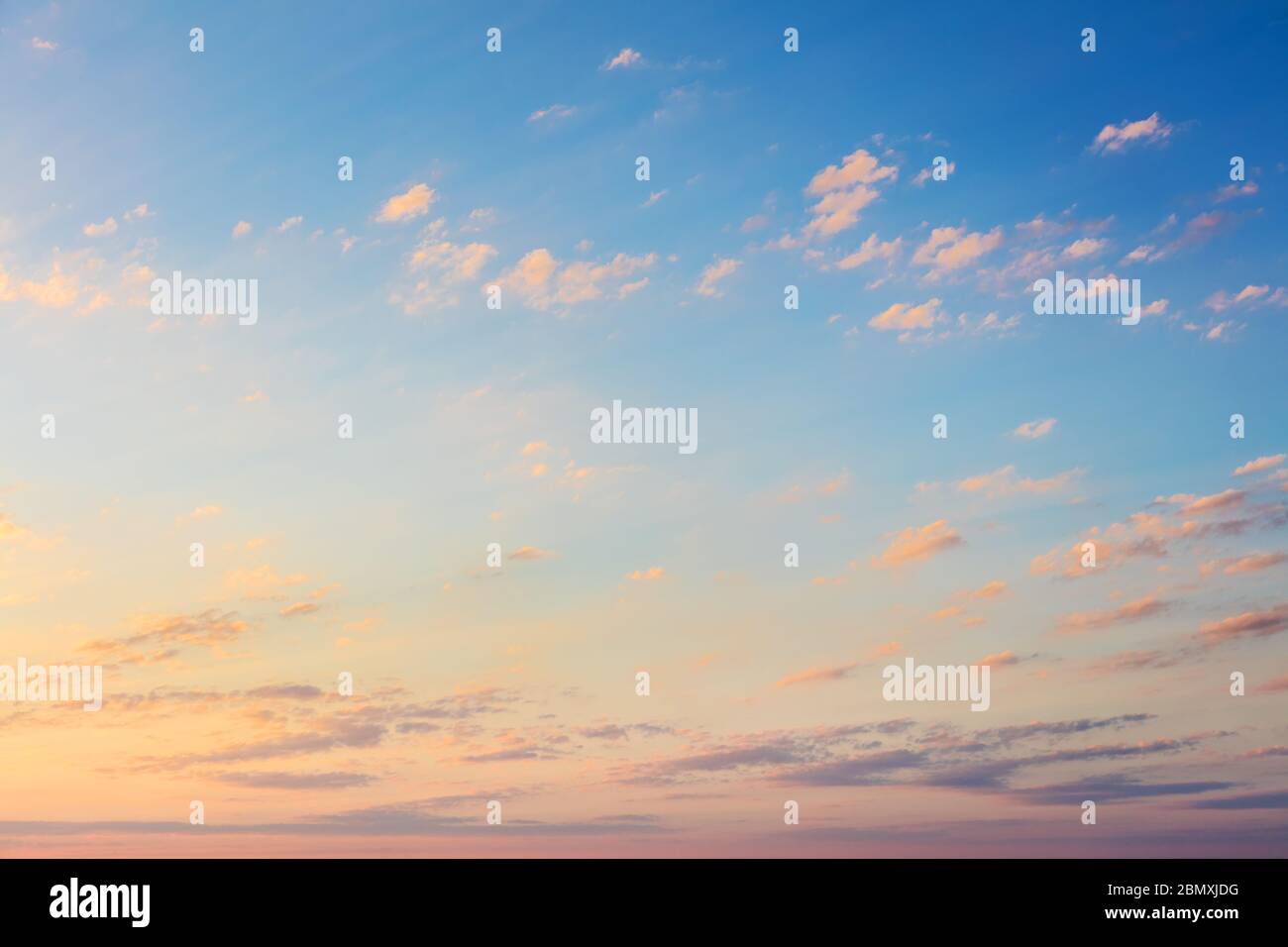 Gentle Natural Sunset Sunrise sky with light clouds and pastel colors ...
