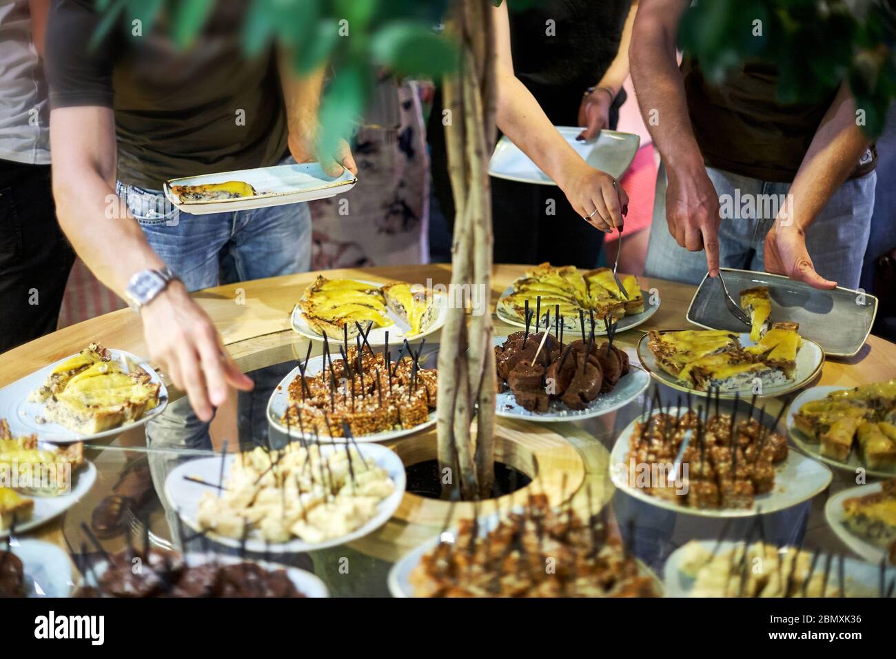 men in blue suits choosing food at a banquet Stock Photo - Alamy