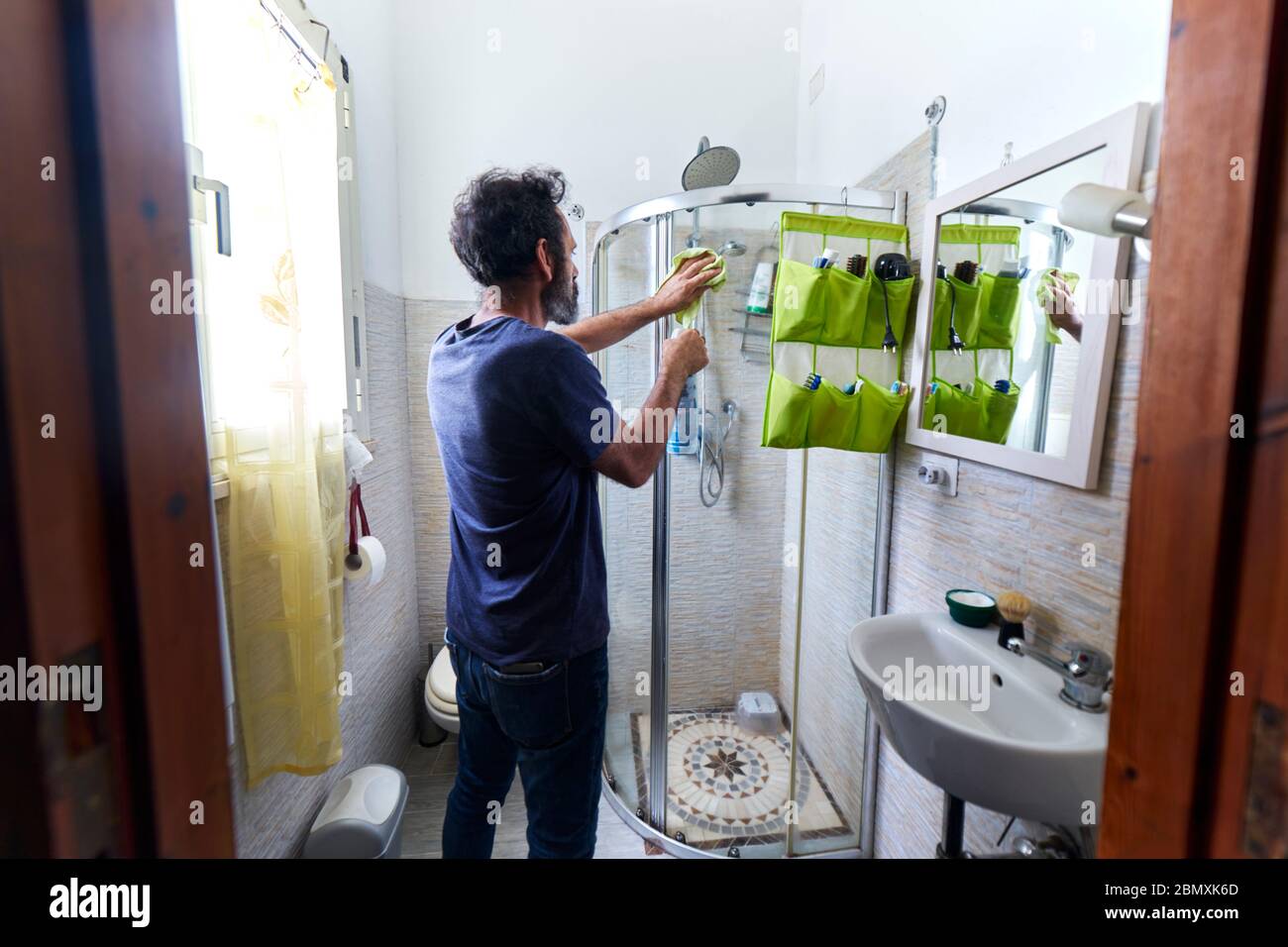 Cleaning shower bathroom man hi-res stock photography and images - Alamy