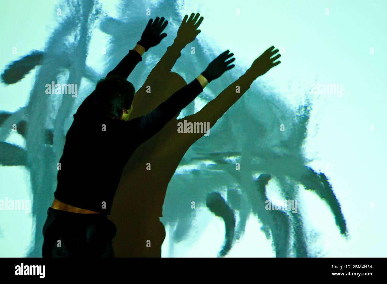 man dressed in black on a colorful background Stock Photo - Alamy