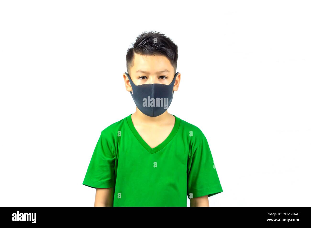 Isolated Asian boy wearing a mask on a white background with clipping ...