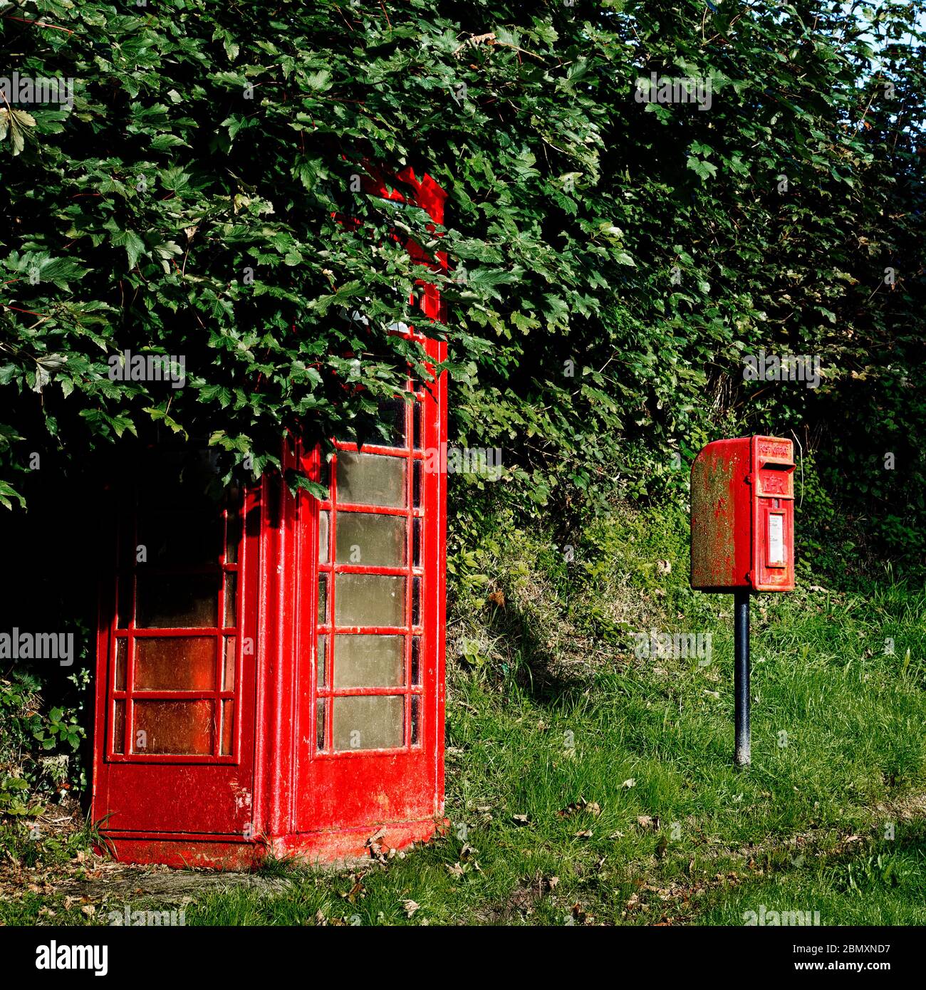 Red phone box and letterbox in rural UK Stock Photo - Alamy