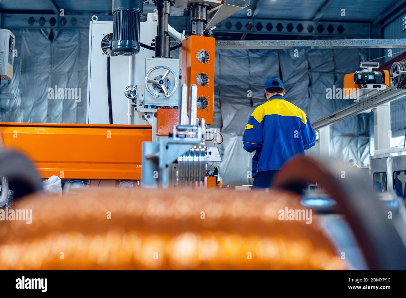 Production of copper wire, cable in reels at factory. Cable factory ...