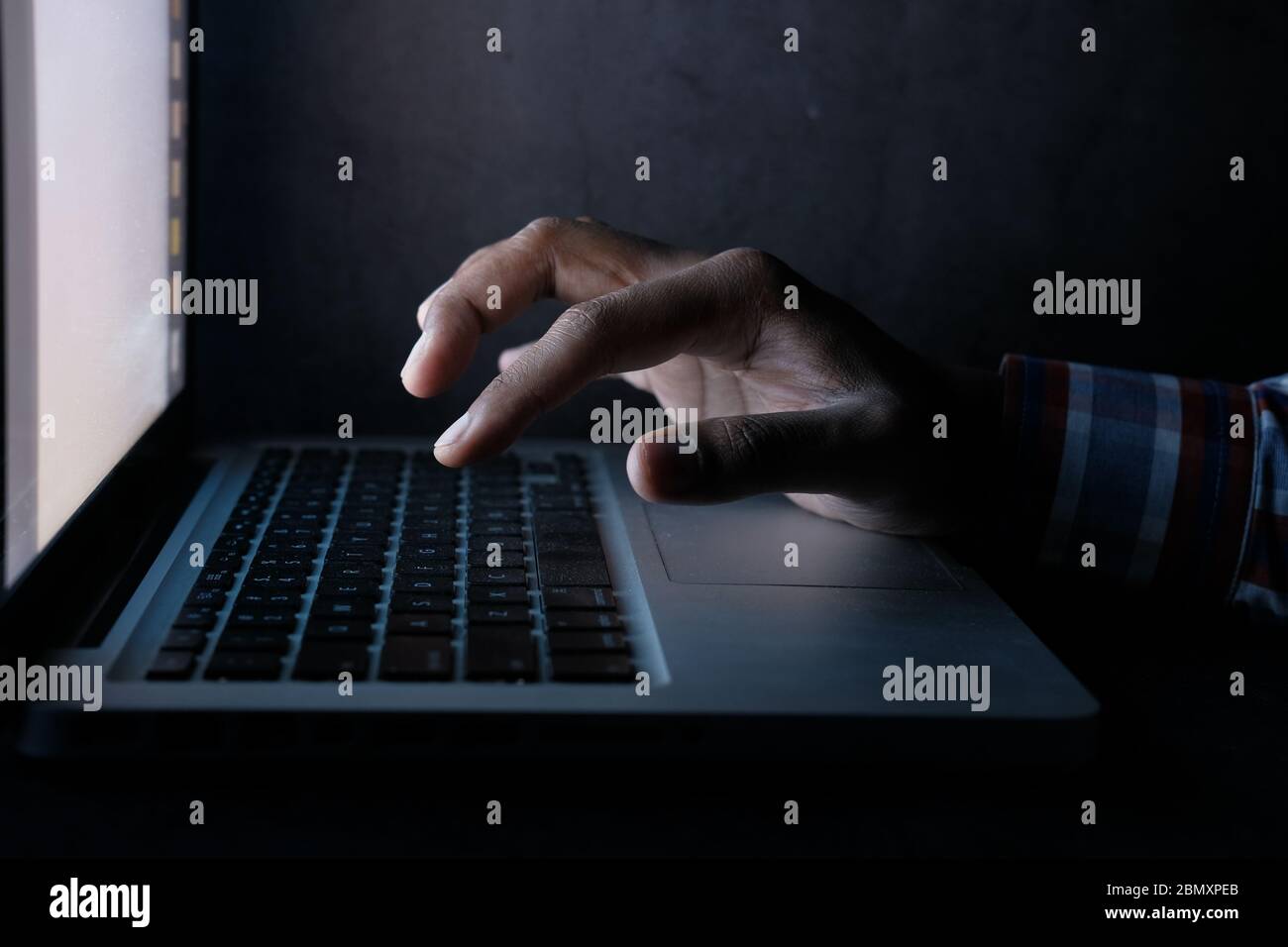 hacker hand stealing data from laptop at night Stock Photo - Alamy