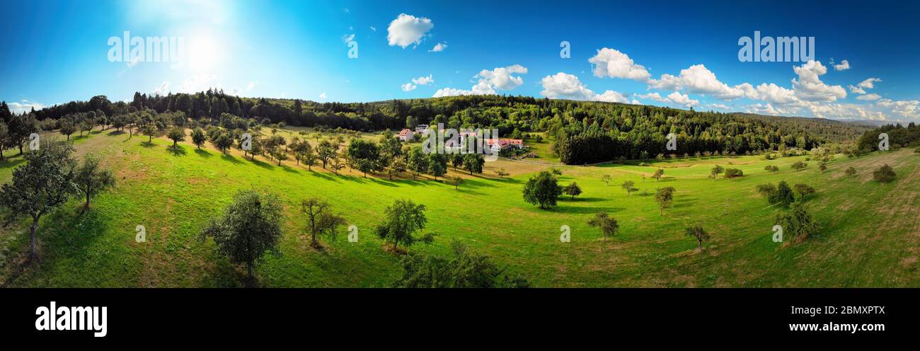 Wide aerial panorama view of a nice rural landscape with green meadows ...
