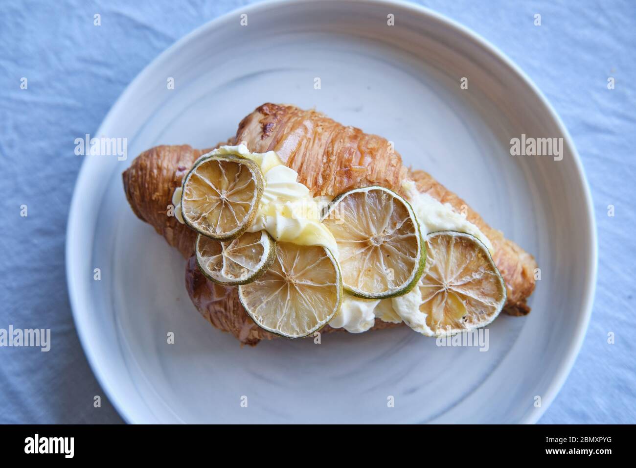 croissant with creame patisserie and lemon Stock Photo - Alamy