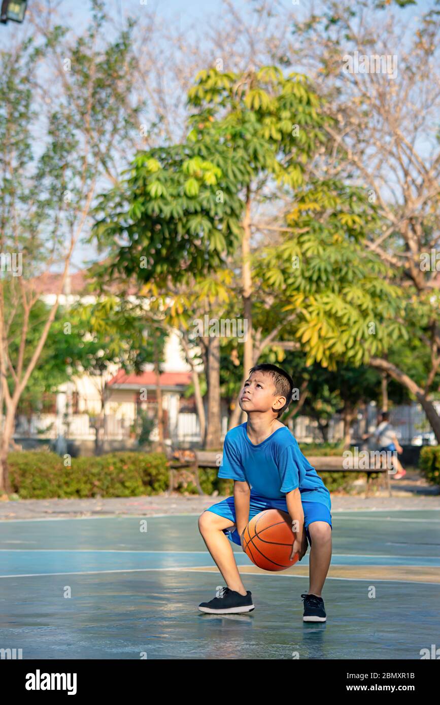 With a basketball ball hi-res stock photography and images - Alamy
