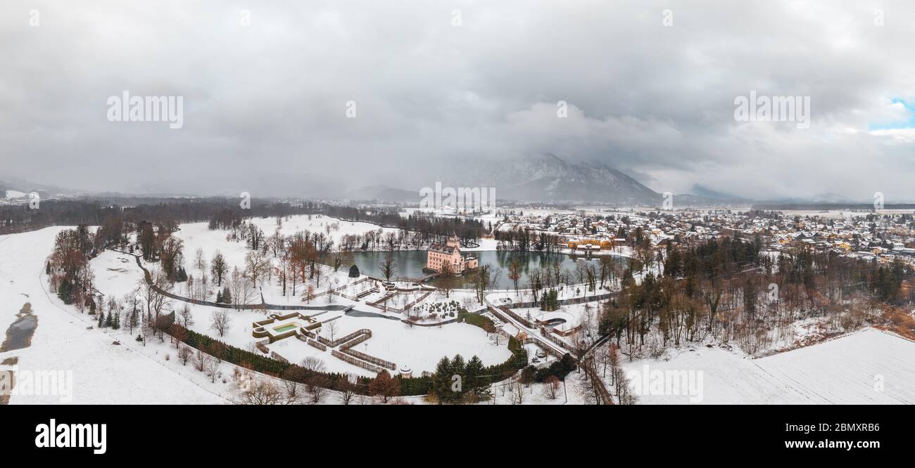 Panoramic aerial view of Schloss Anif castle moated in artificial pond ...
