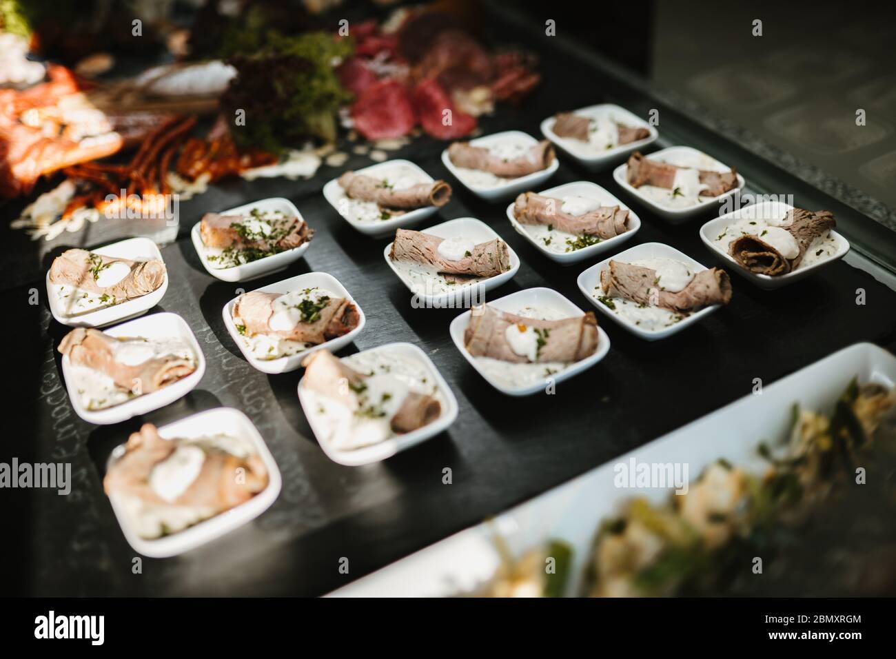 photo of an open buffet small plates Stock Photo - Alamy