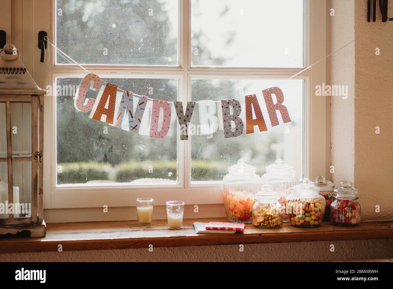 photo of candy bar jars on a window Stock Photo - Alamy