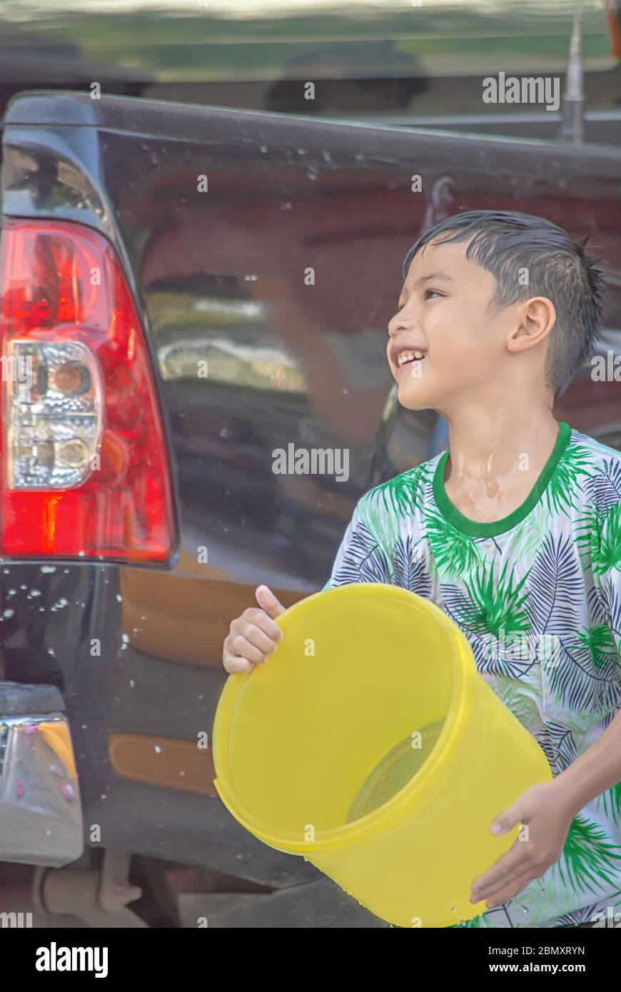 Asian boy holding Plastic bucket play Songkran festival or Thai new ...