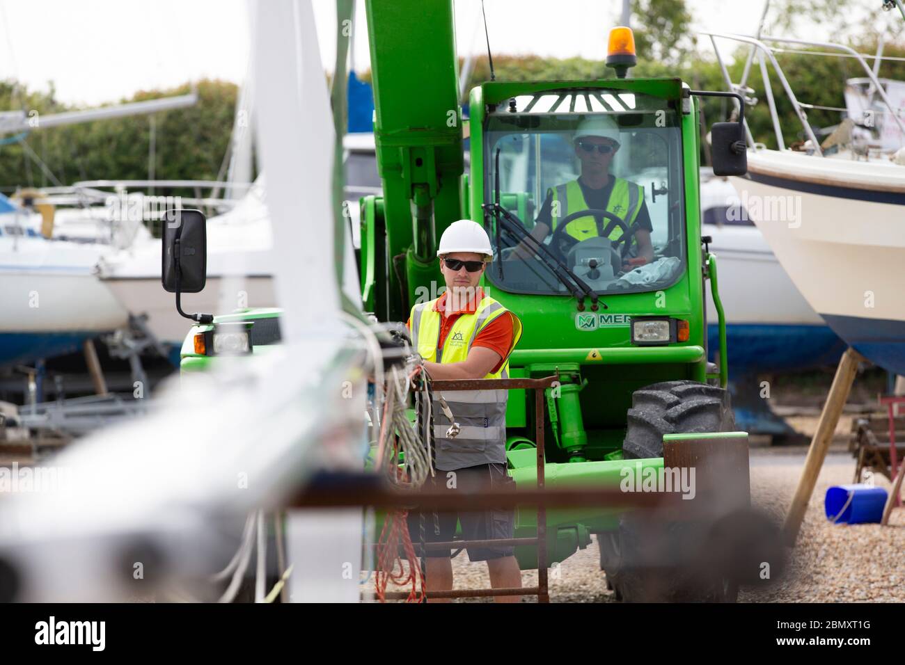 Staff working at UK boatyard Stock Photo - Alamy