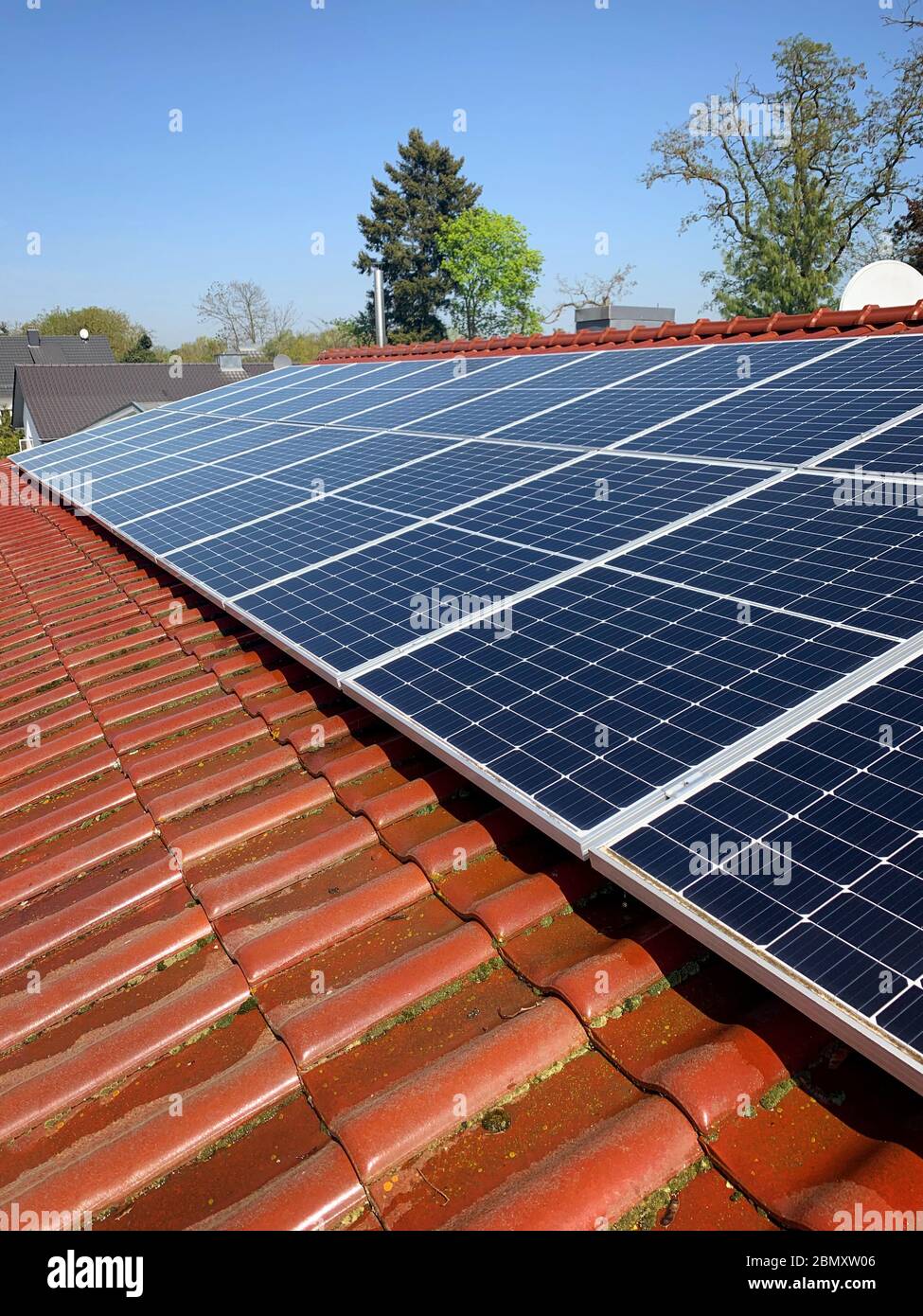 Photovoltaic solar panel installed on a roof Stock Photo - Alamy
