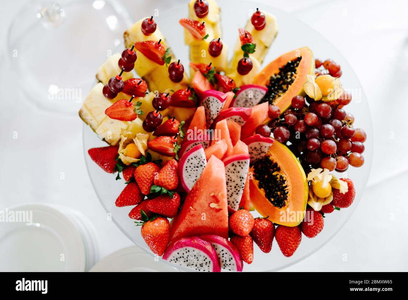 photo of fresh fruit slices plate on a table Stock Photo - Alamy