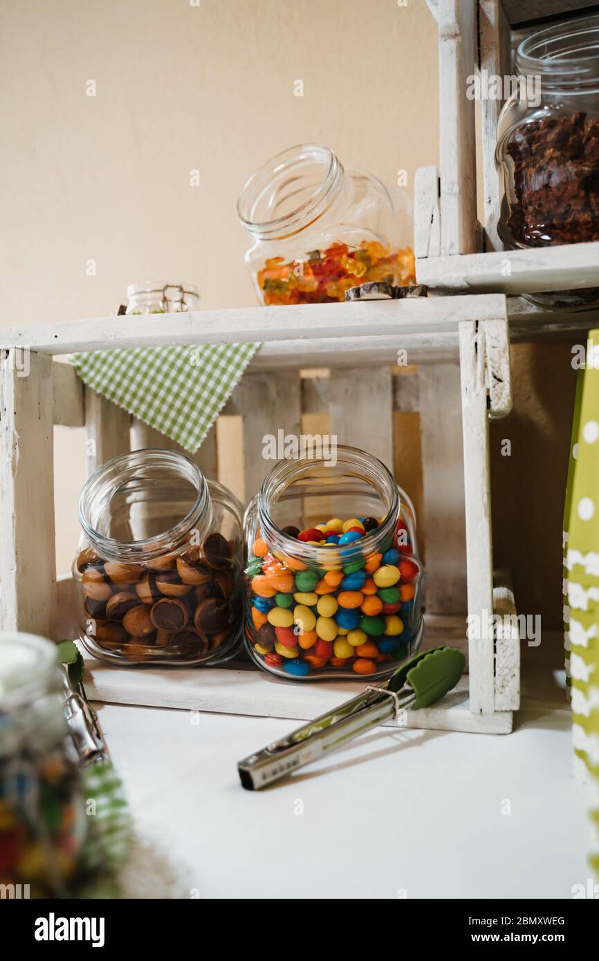 photo of candy jars on a table in the kitchen Stock Photo - Alamy