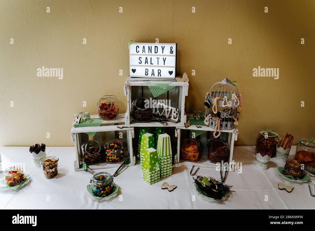 photo of candy bar jars on a table with a letter board Stock Photo - Alamy