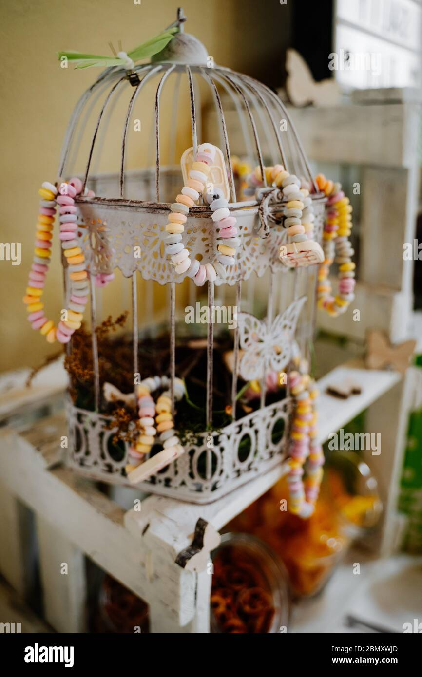 photo of candy bracelets hanged on a candy cage Stock Photo - Alamy