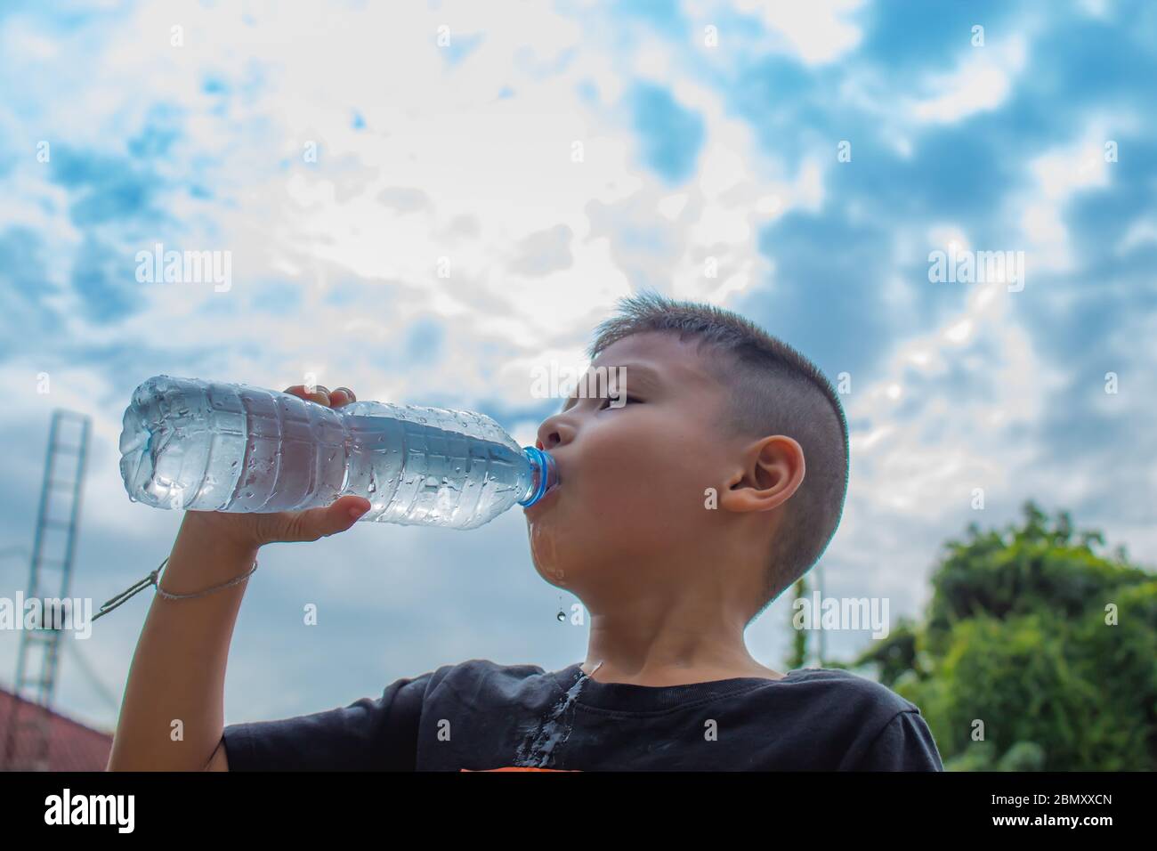The boys are drinking cold water Stock Photo - Alamy
