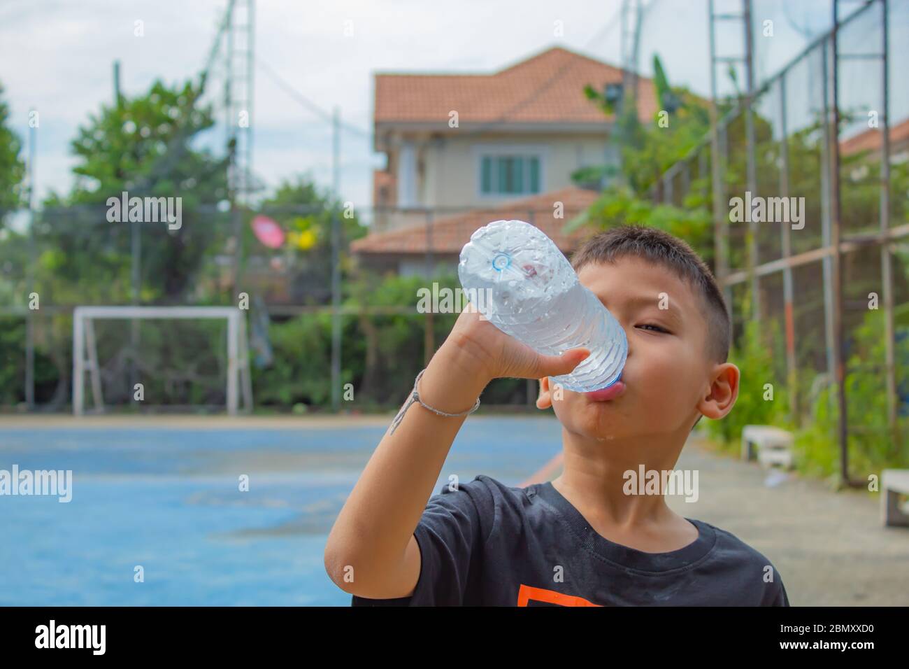 The boys are drinking cold water Stock Photo - Alamy