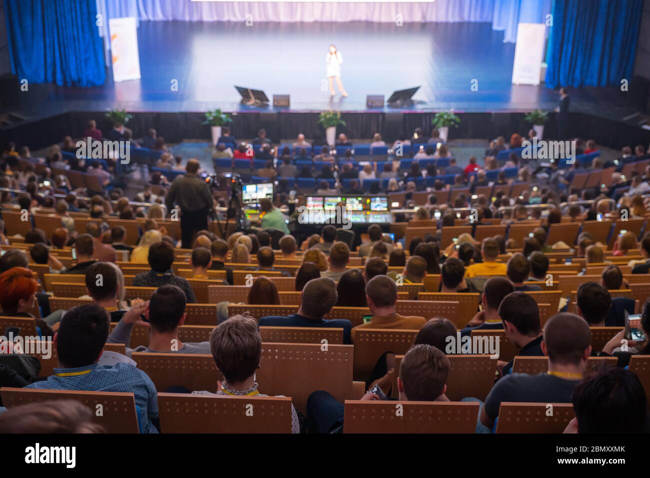 Attendees sitting in conference hall hi-res stock photography and ...