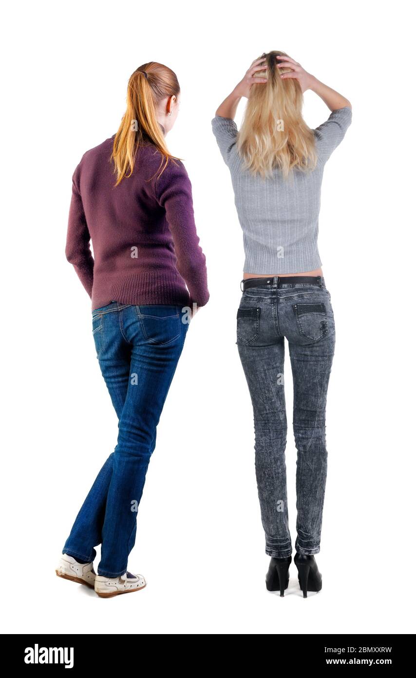 Back view of two woman in sweater. Rear view people collection ...