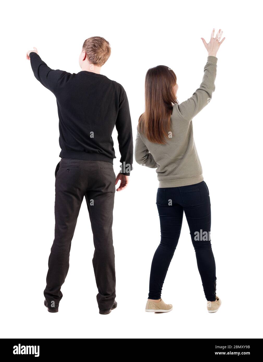 Back view of couple in sweater pointing. Rear view people collection ...