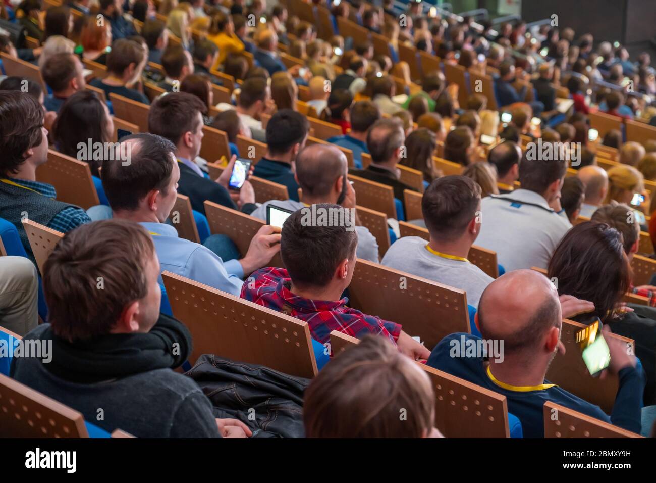 Business conference attendees sit and listen Stock Photo - Alamy
