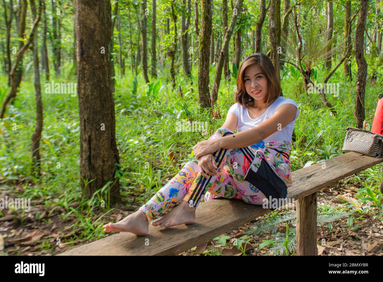 Portrait of Asian women. The background of green trees Stock Photo - Alamy