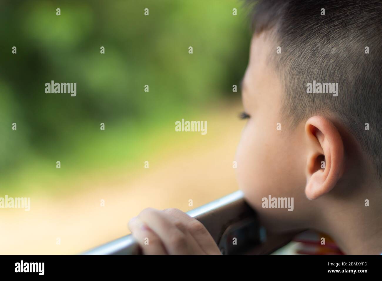 The boys are watching a train window views Stock Photo - Alamy