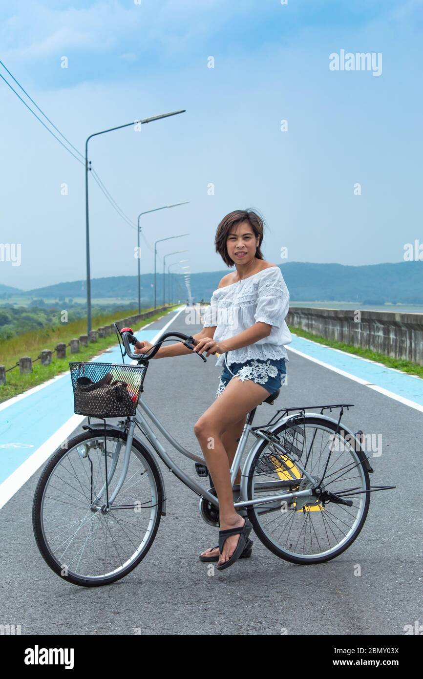 Farm girl on bike hi-res stock photography and images - Alamy