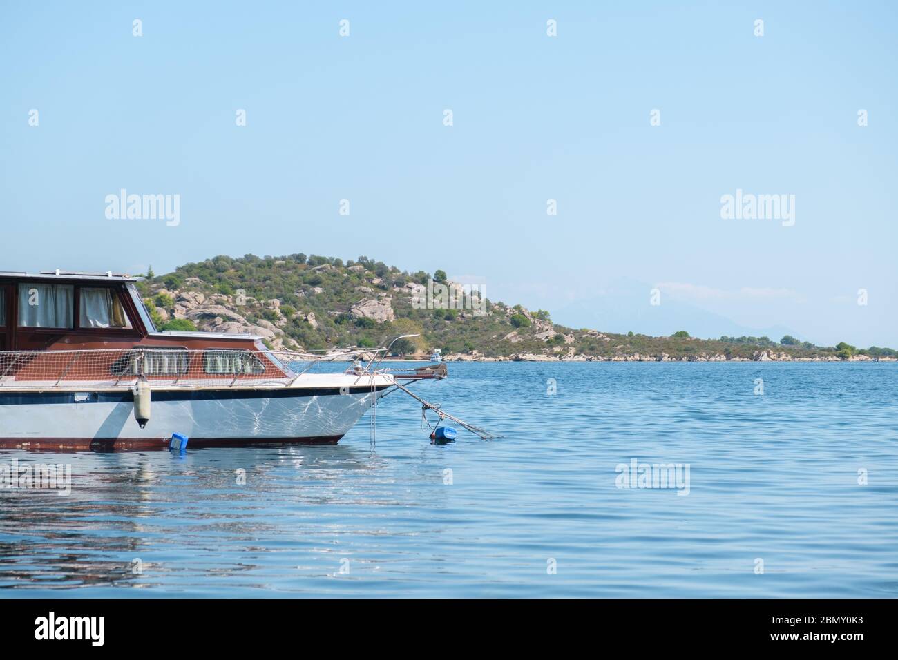 Half boat on the left side in the water with copy space Stock Photo - Alamy