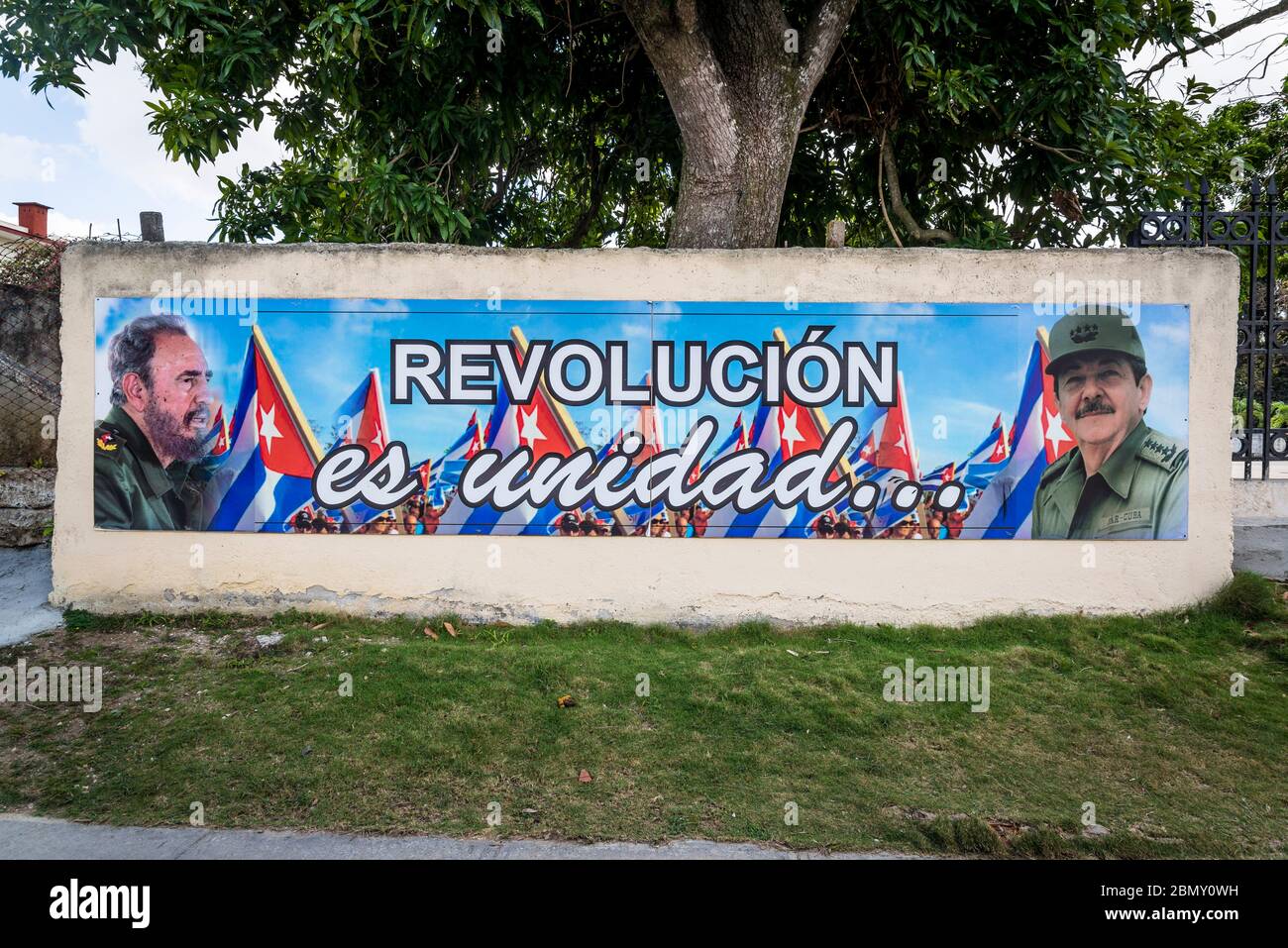 Political hoarding with the slogan Revolution is unity, and pictures of ...