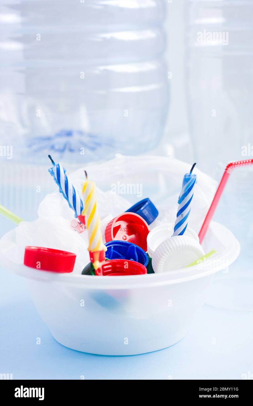 Pile of single use plastic garbage including drinking straws, cup ...