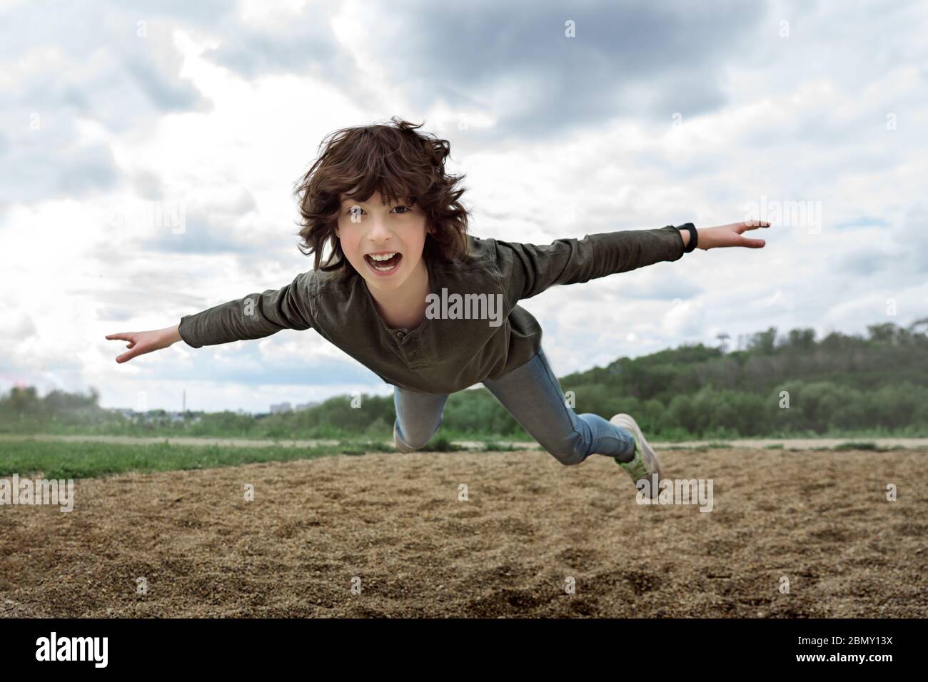 Joyful boy in flight (levitation effect Stock Photo - Alamy