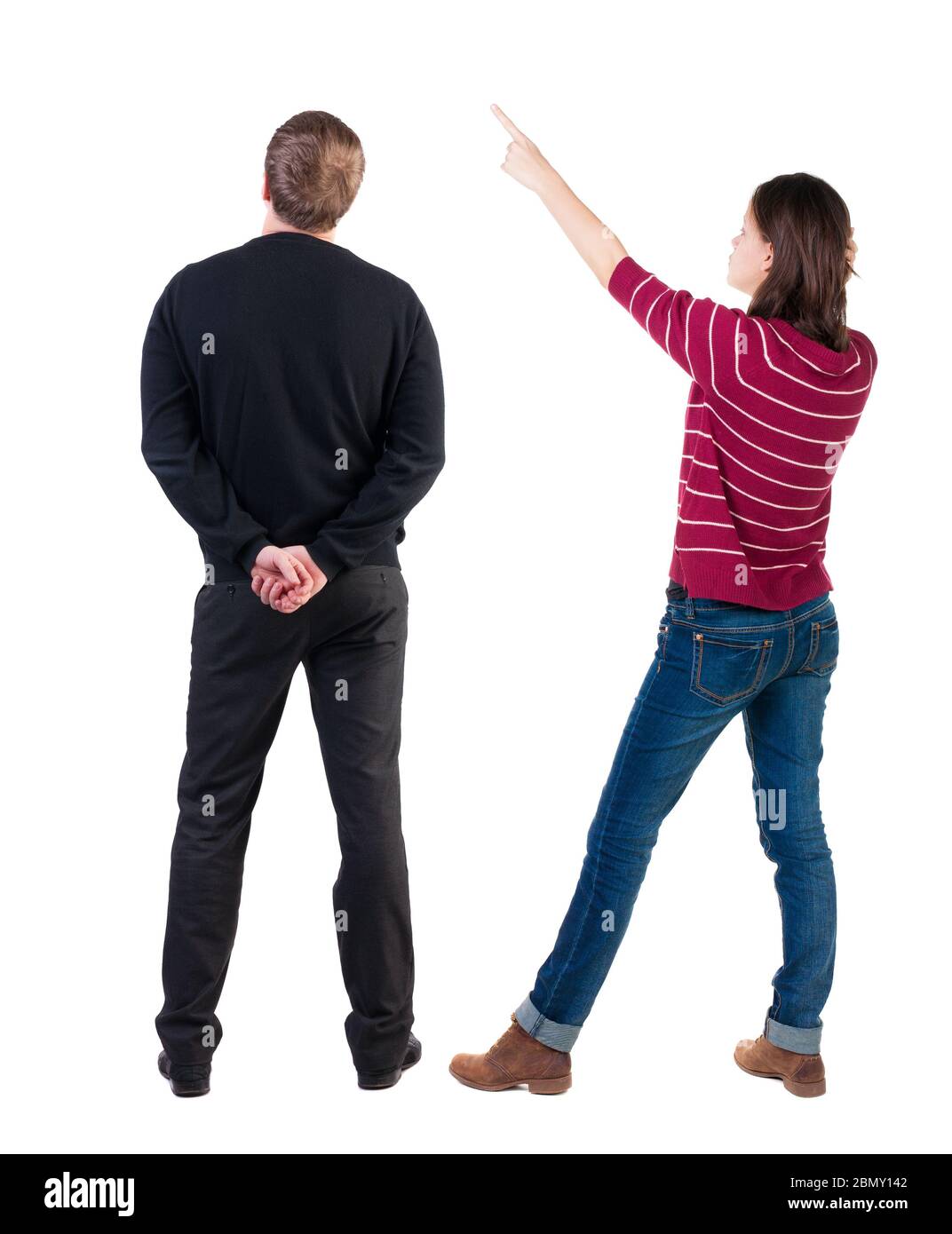 Back view of couple in sweater pointing. Rear view people collection ...