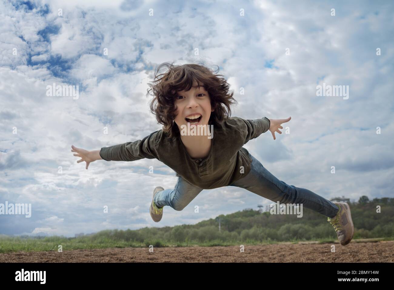 Joyful boy in flight (levitation effect Stock Photo - Alamy