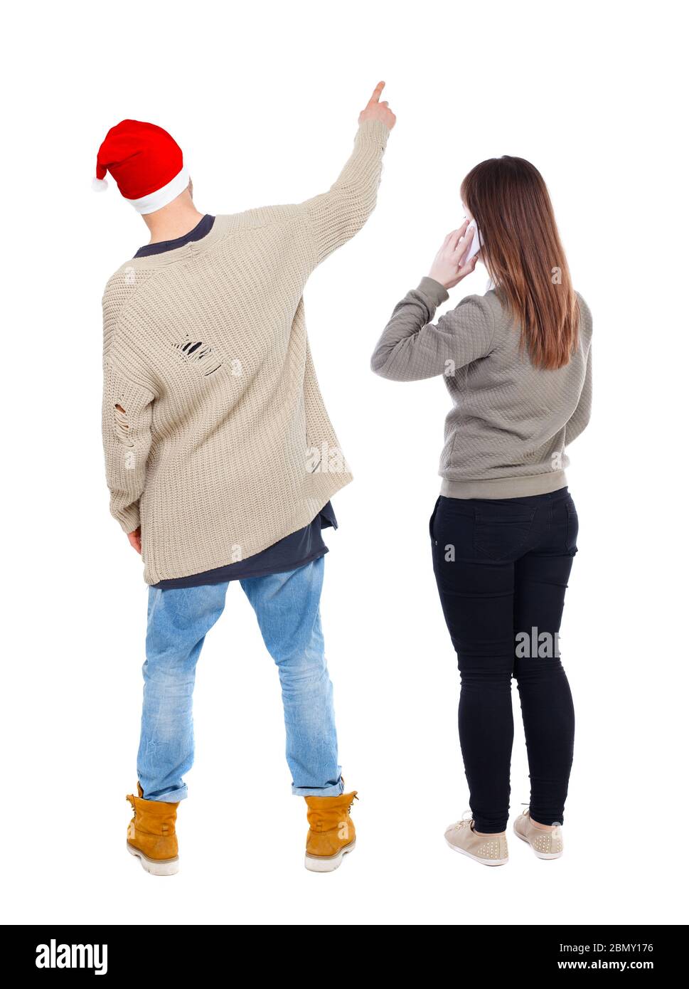Back view of couple in sweater with mobile phone. beautiful friendly ...
