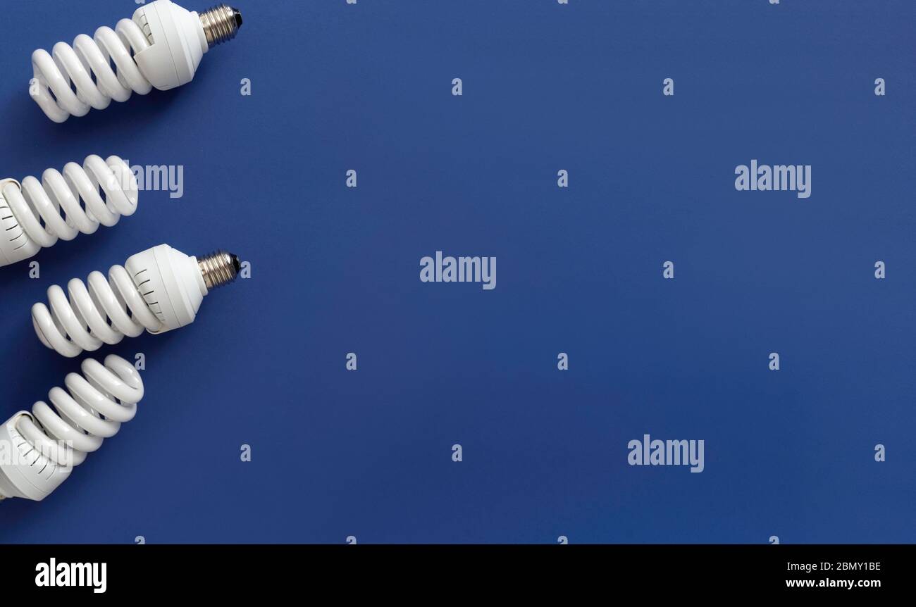 Four halogen white lamps on the left of classic blue background Stock ...