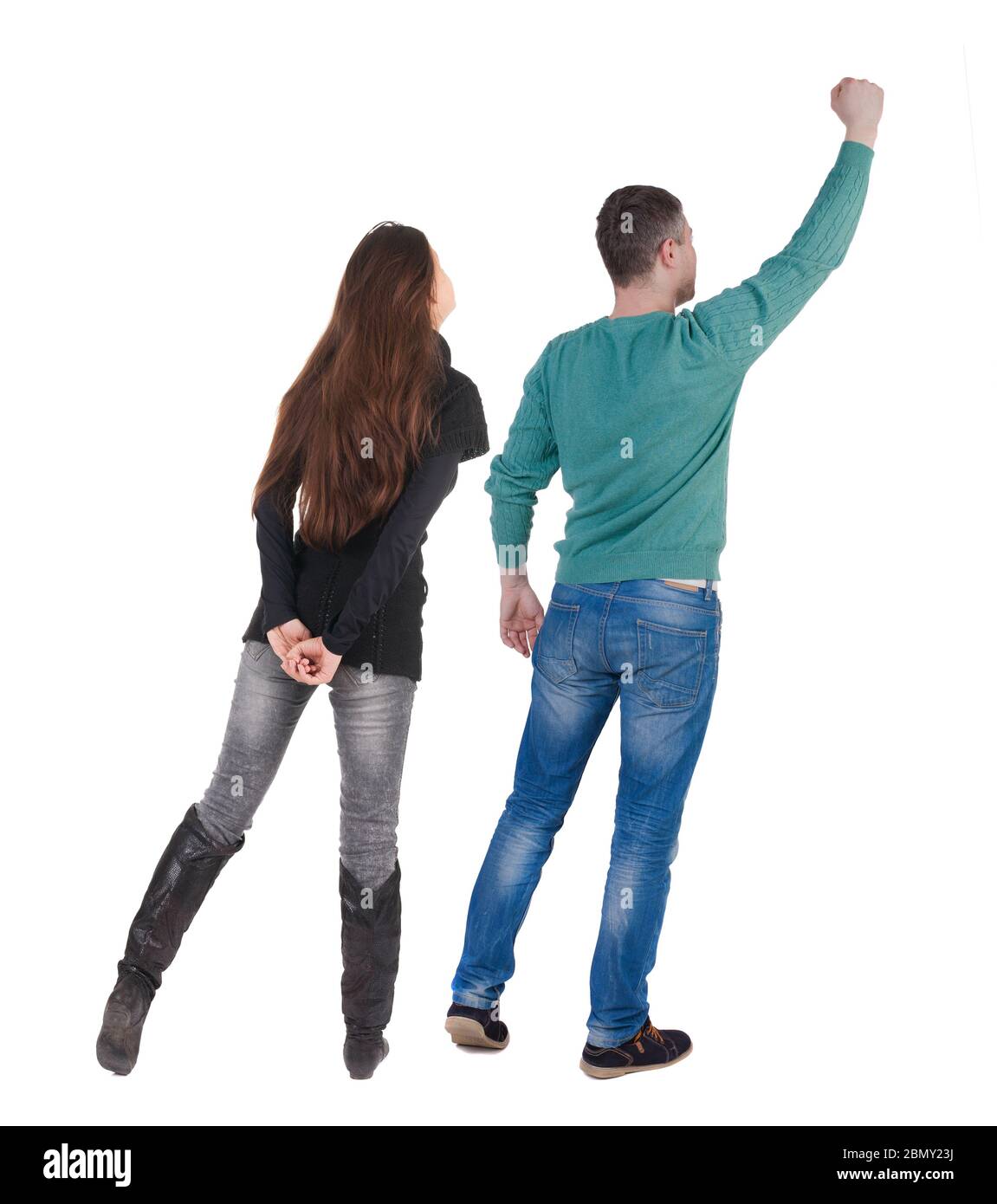 Back view of couple in sweater pointing. Rear view people collection ...