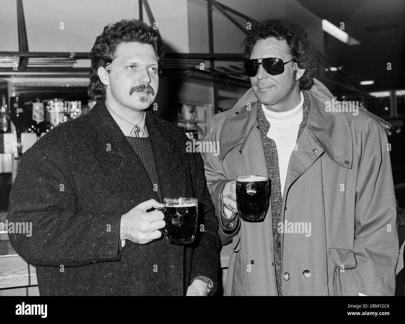 Welsh singer Tom Jones drinking a beer with his son Mark at Heathrow ...