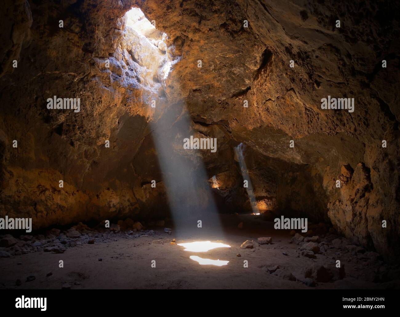 Sun Beams Shine Down Through Cave Ceiling 3 Stock Photo - Alamy