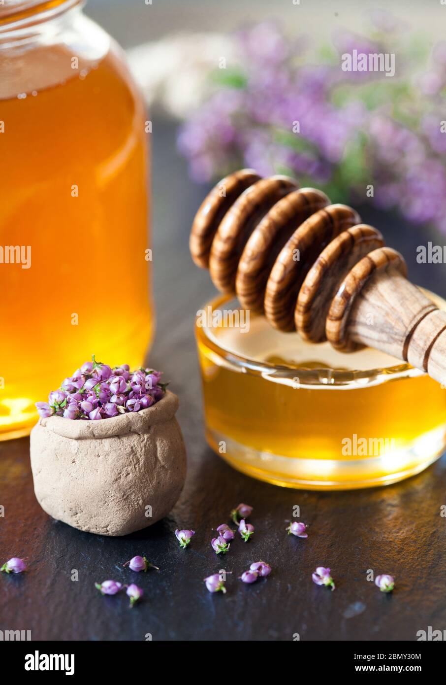 Beautiful composition of fresh natural honey, wooden honey dipper and ...