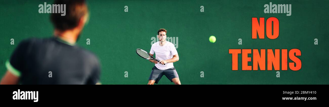 Tennis players playing on court with sign NOT ALLOWED banner panoramic ...