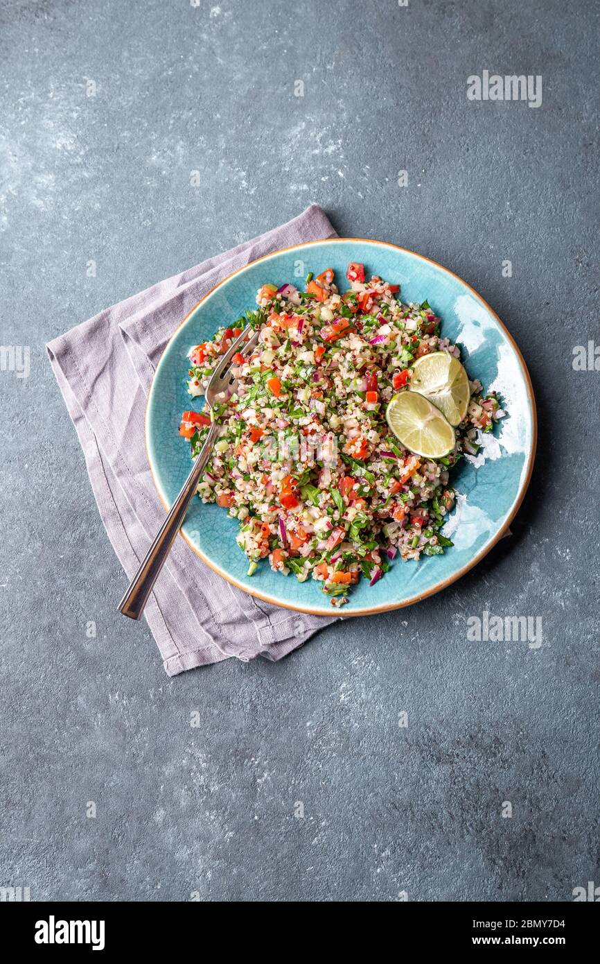 Traditional Lebanese salad tabouli tabule with quinoa, herbs, tomatoes ...