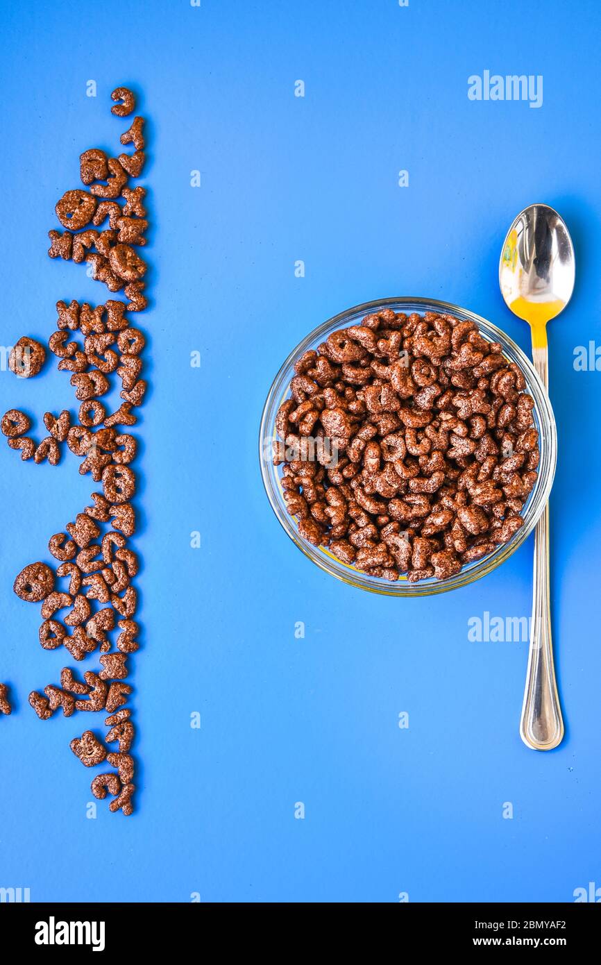 Chocolate cornflakes in the shape of letters of the English alphabet ...