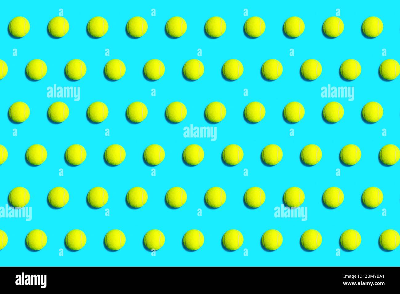 Trendy pattern made of tennis ball on blue green mint background. Sport ...