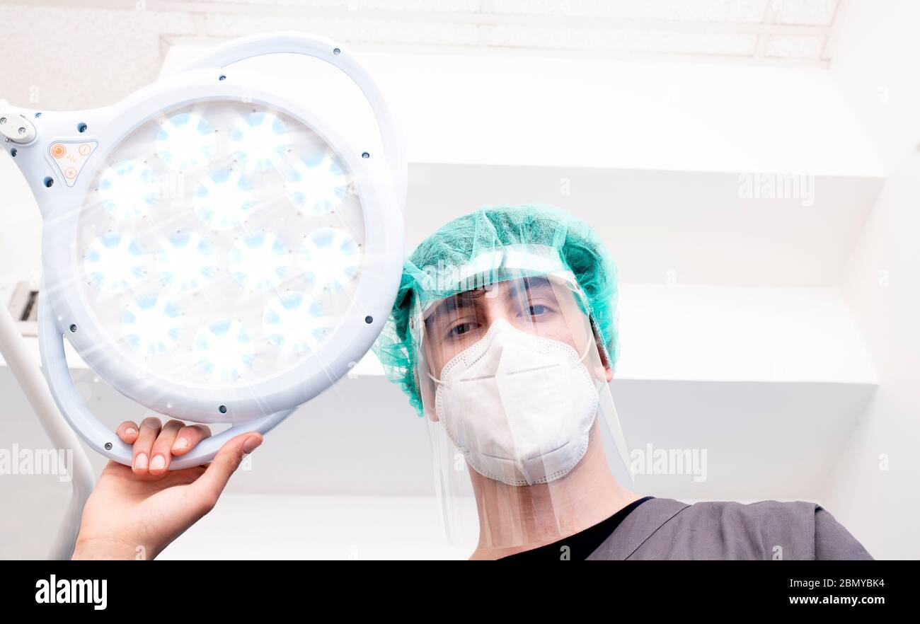 a surgeon look the patient in first person camera Stock Photo - Alamy