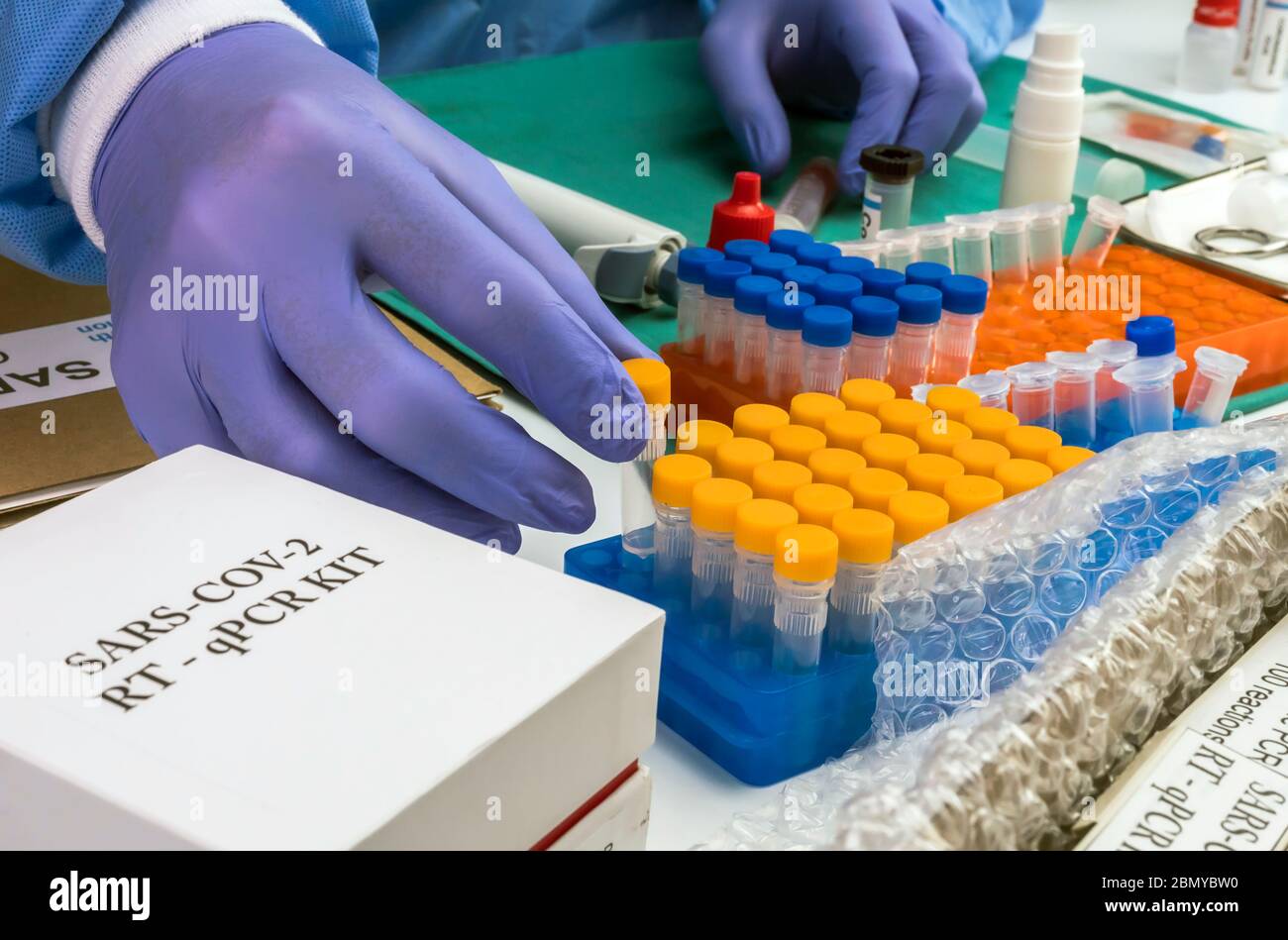 Nurse unpacking box with Covid-19 PCR kit in hospital warehouse ...
