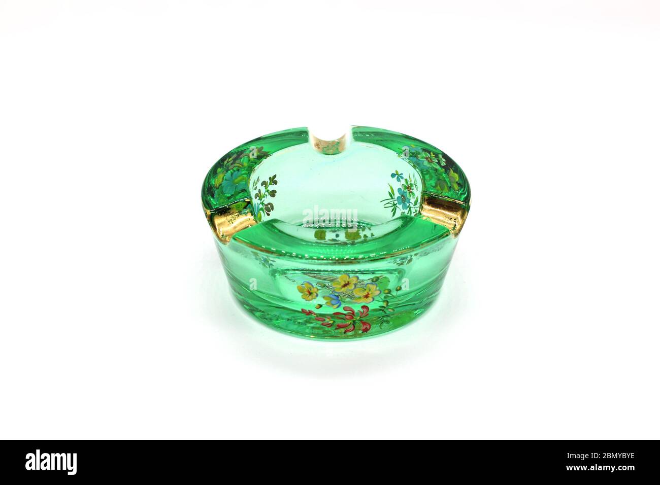 Old green transparent glass ashtray, isolated on a white background ...